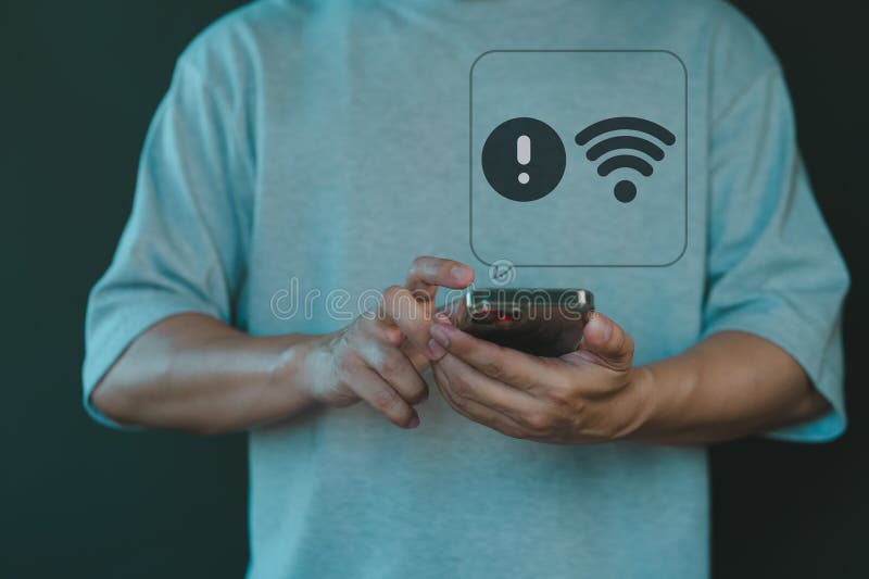 A Person Interacts with a Smartphone, Displaying a Warning Notification ...