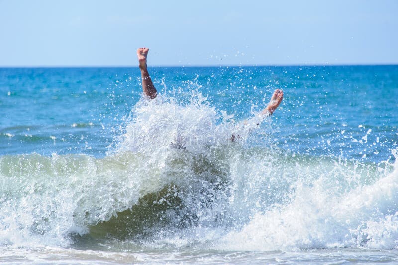 Person jumping on wave stock photo. Image of leisure - 41137052