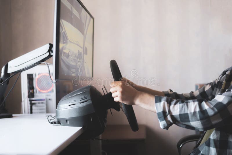 A Person Learns How To Drive the Car Using an Auto Computer Simulator ...