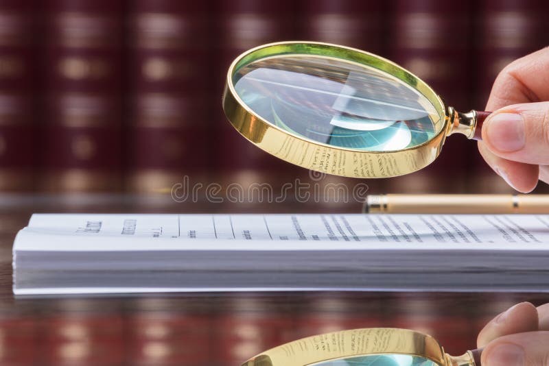 Person Looking at Document with Magnifying Glass Stock Image - Image of ...