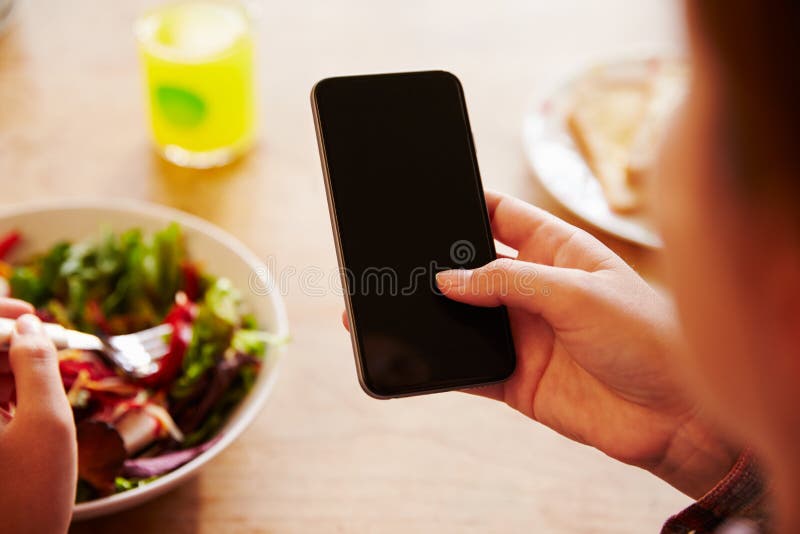 Person at Lunch Looking at To Mobile Phone Stock Photo - Image of home ...