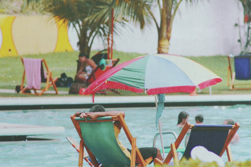 Person Lying On Bench Near Swimming Pool Stock Image - Image of pool ...