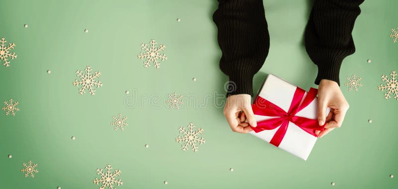 Person Making a Christmas Gift Box Stock Photo - Image of shadow ...