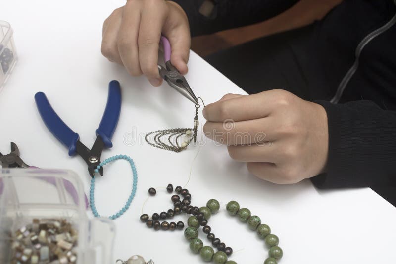 Person Making Jewelry with Beads and Other Materials with Tools Stock ...