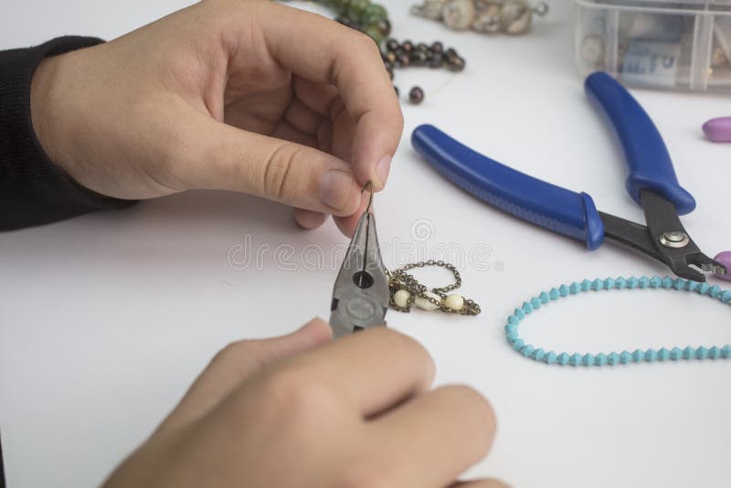 Person Making Jewelry with Beads and Other Materials with Tools Stock ...