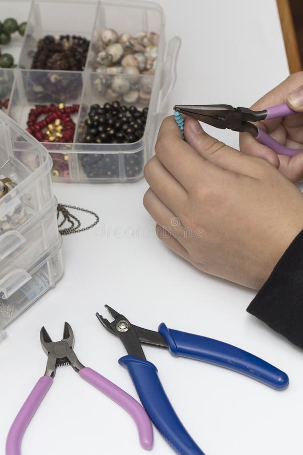 Person Making Jewelry with Beads and Other Materials with Tools Stock ...
