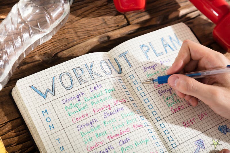 Person Making Note of Workout Plan on Notebook Stock Photo - Image of ...