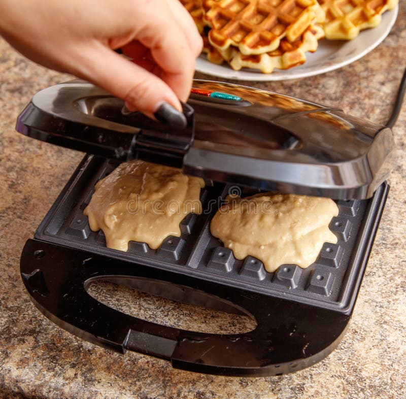 A Person is Making Waffles in a Waffle Maker Stock Image - Image of ...