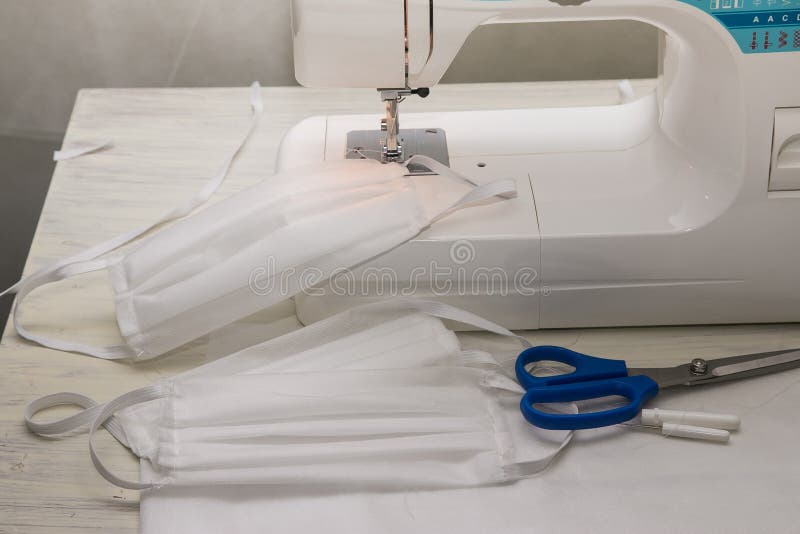 A Person Making White Masks for Corona Virus Stock Image - Image of ...