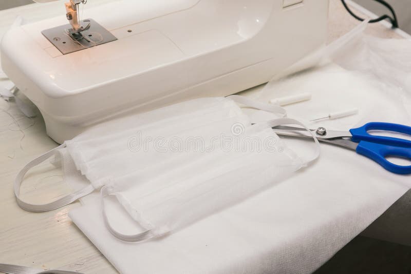 A Person Making White Masks for Corona Virus Stock Photo - Image of ...