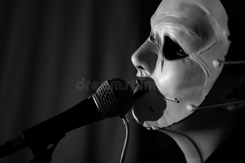 Person with a Mask Whispering into a Hidden Microphone Stock Image ...