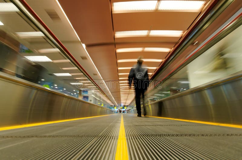 Person on Moving Travelator Stock Photo - Image of speed, perspective ...
