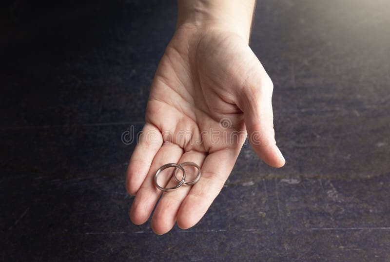 Person Offering a Pair of Wedding Rings Stock Photo - Image of lady ...