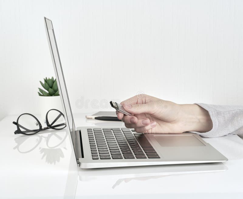 Person Opening Usb Flash Next To Laptop, Office Work Concept on White ...