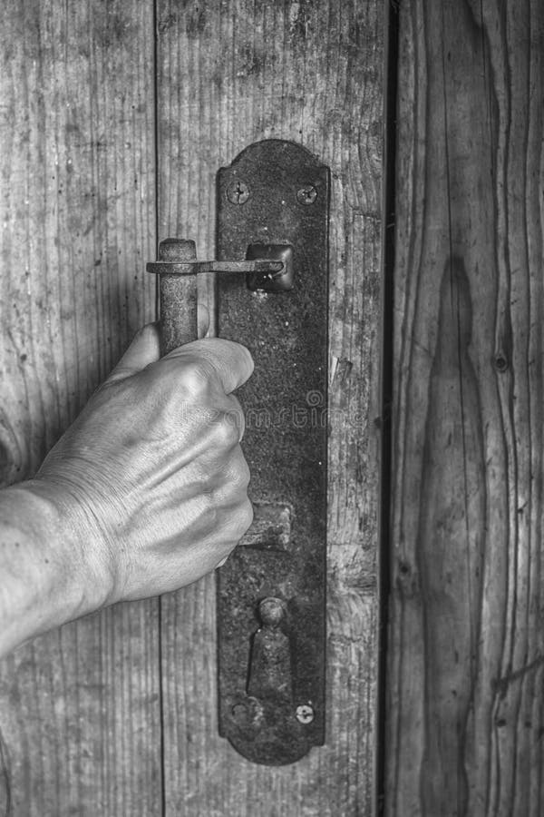 A Person Opens Door of a Wooden Hand with an Old Handle Stock Photo ...