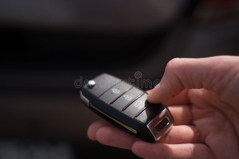Person Opens the Trunk of the Car with a Remote Access Key. Close-up ...