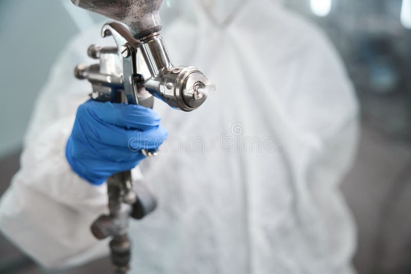 Person with a Paint Injection Tank in His Hands Stock Image - Image of ...