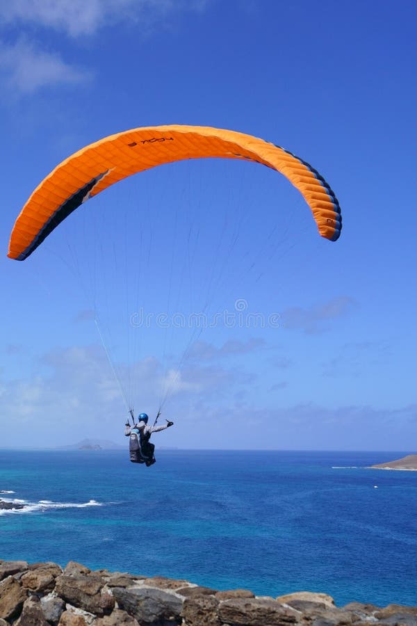 Person Paragliding Over Cliffs Near the Sea Stock Photo - Image of ...