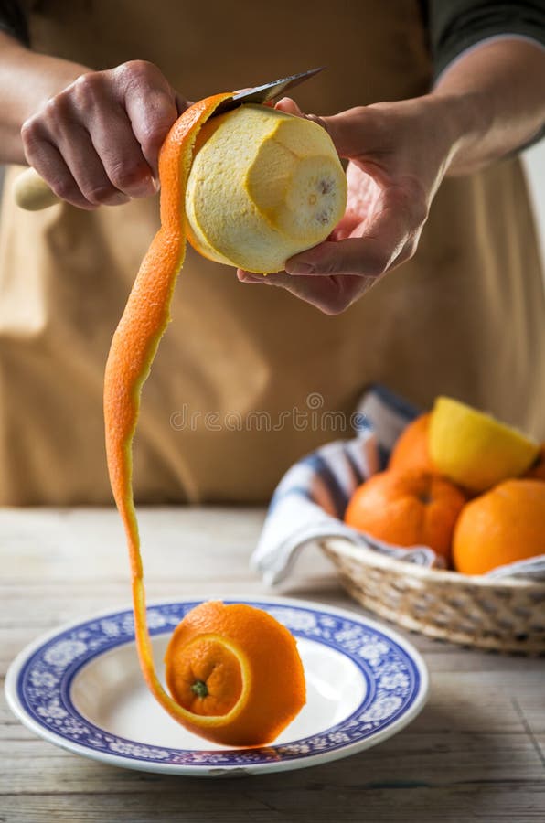 Person peels an orange stock photo. Image of snack, hands - 68148664