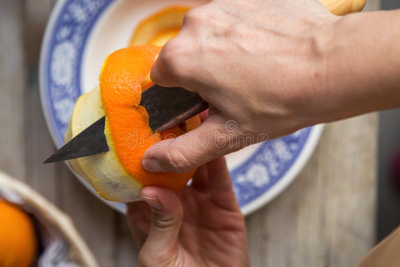 Person peels an orange stock image. Image of close, kitchen - 68148827