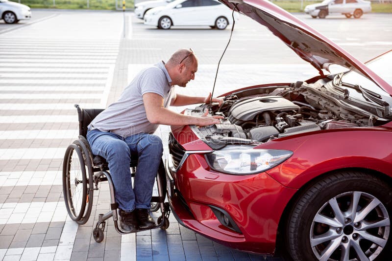 Person with a Physical Disability Check Engine His Car at Parking Stock ...