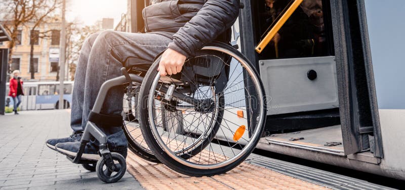 Person with a Physical Disability Exits Public Transport with an ...