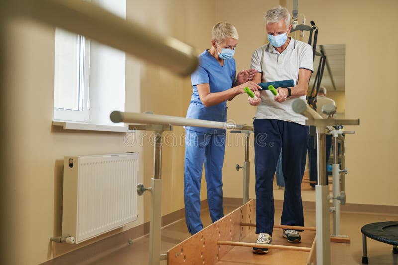 Therapist Walking Patient Parallel Bars Stock Photos - Free & Royalty ...
