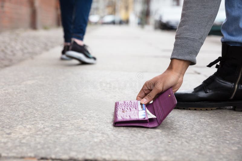 Guy Picking Up A Lost A Lost Purse/wallet Stock Image - Image of ...