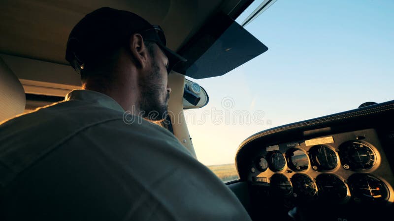 A Pilot Sitting in a Cockpit while Flying, Close Up. Stock Footage ...