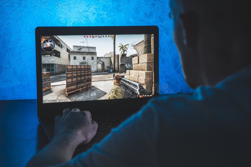 Person Playing Counter Strike Global Offensive Video Game on Computer ...