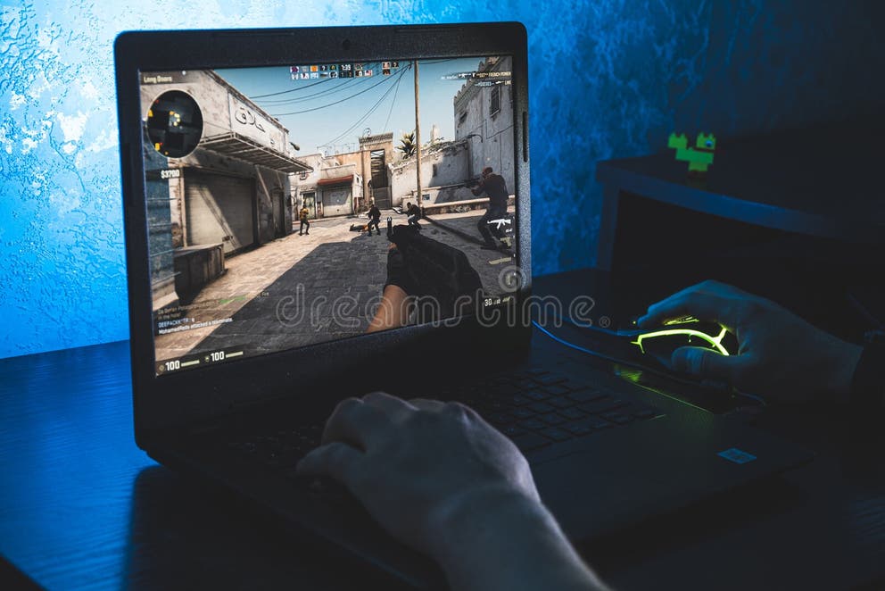 Person Playing Counter Strike Global Offensive Video Game on Computer ...