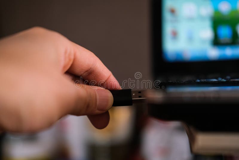 Person Plugging a USB Cable into the Port of a Laptop Stock Photo ...