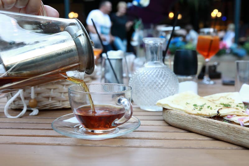Person pouring tea stock photo. Image of brown, handle - 30044602