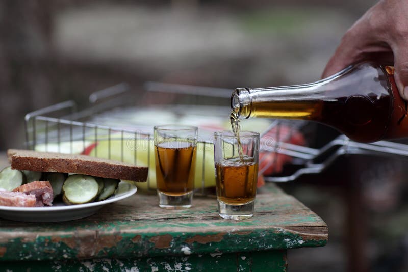 Person pouring brandy stock image. Image of liquid, grill - 49372495