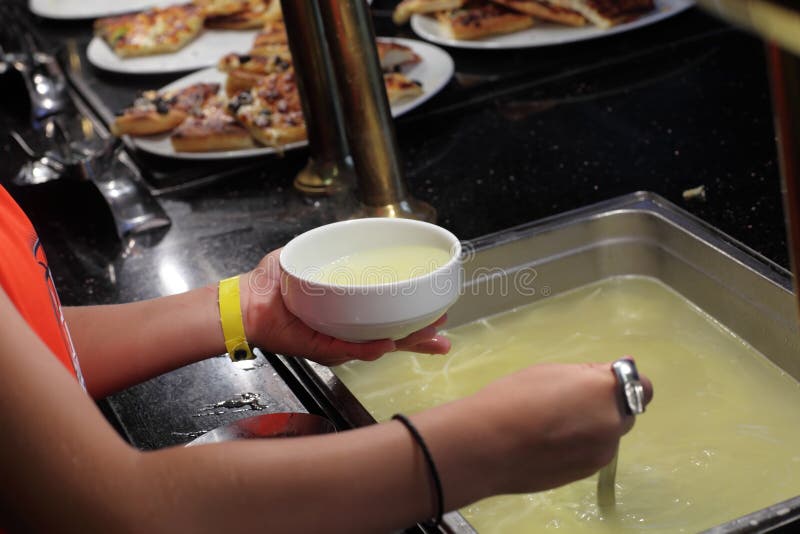 Person pouring broth stock photo. Image of holding, dinner - 46601496