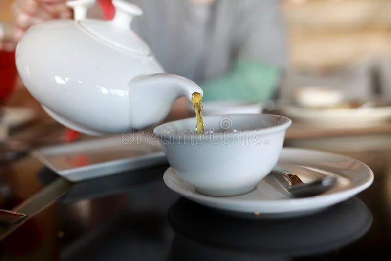 Person Pouring Tea from White Teapot Stock Photo - Image of aroma ...
