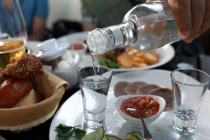 Person pouring vodka stock photo. Image of dish, holiday - 156897598