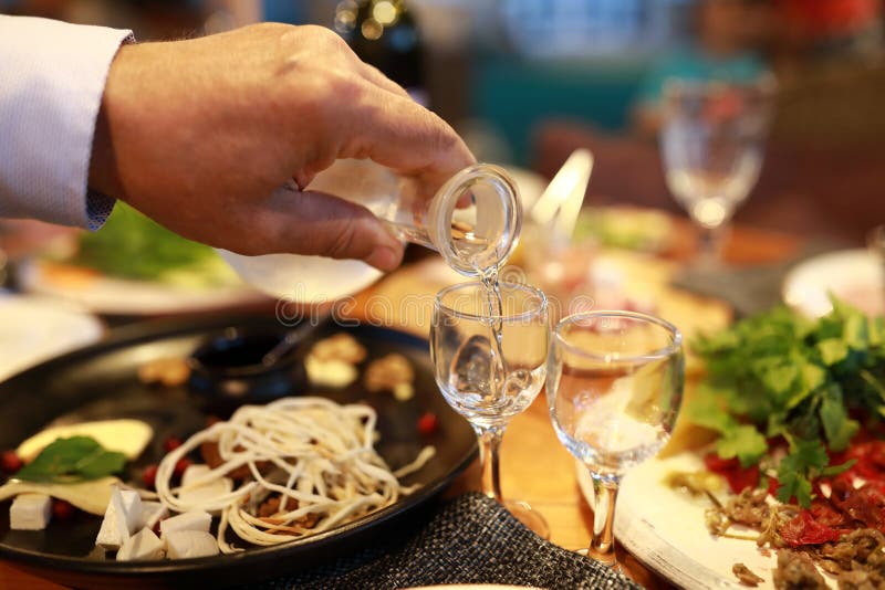 Man pouring vodka stock image. Image of russian, male - 24212725