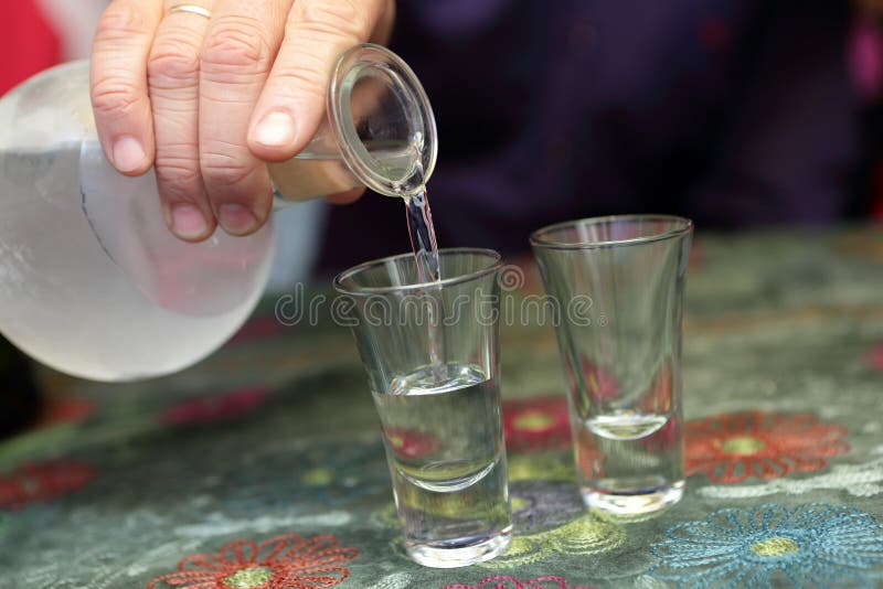 Person pouring vodka stock image. Image of cool, celebrate - 68755399