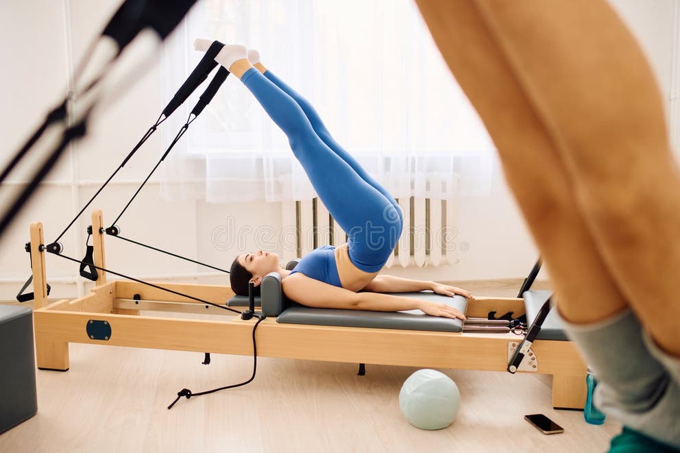 Engaging in an Invigorating Pilates Workout Stock Photo - Image of dhai ...