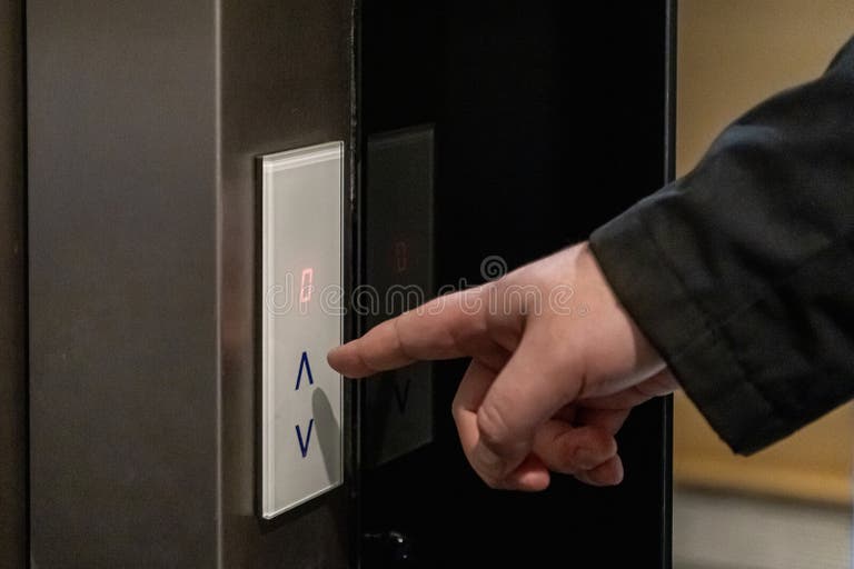 Person Pressing Elevator Button in Modern Building Closeup View of Hand ...
