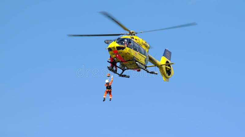A Person is Pulled Up from a Hovering ADAC Rescue Helicopter after ...