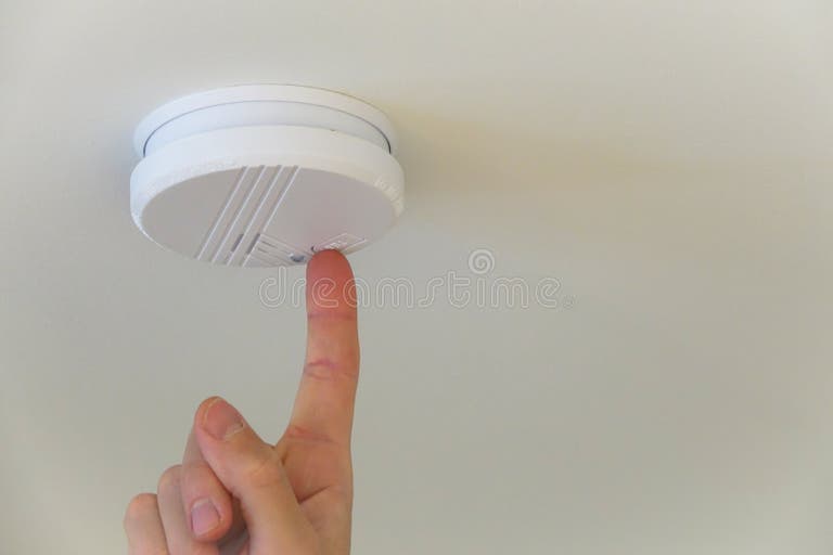 A Person Push the Test Button on a Automatic Smoke Detector Fire Alarm ...