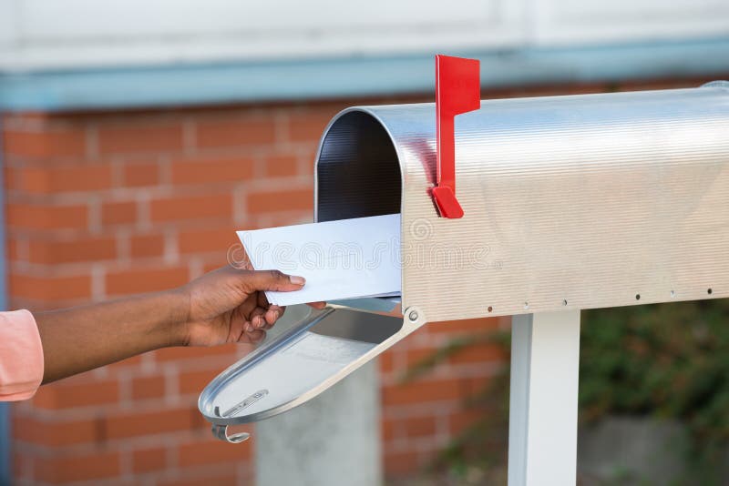 Putting Letters in an Outdoor Metal Mailbox Stock Image - Image of ...