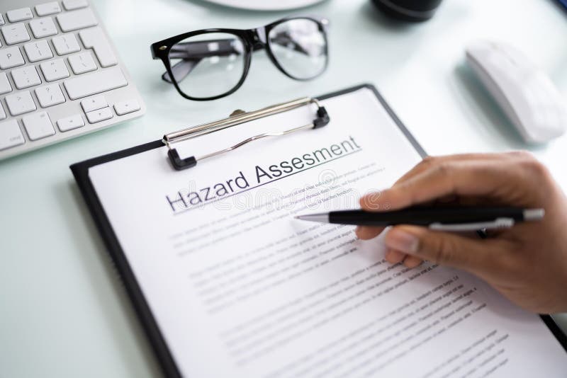 Person Reading Hazard Assessment Document Stock Photo - Image of ...