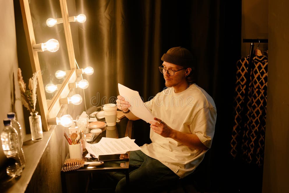 Person Reading Script beside Illuminated Vanity Mirror Stock Image ...