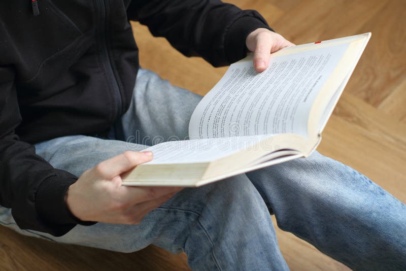 Person reads a book stock photo. Image of hands, paper - 269327902