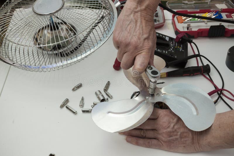 Person repair the fan stock photo. Image of tester, tools - 72791892