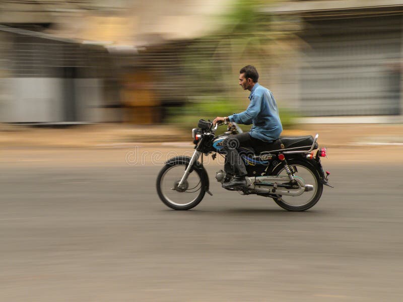Person Riding Motorcycle on Road Foto de archivo editorial - Imagen de ...