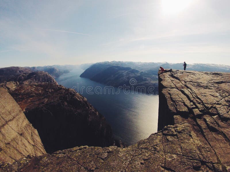 Person on rocky precipice stock photo. Image of mountains - 83017722